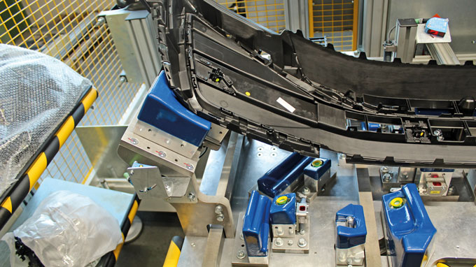 Laser Sensor Detects Black Bumpers in Assembly Cell - Turck Inc. USA